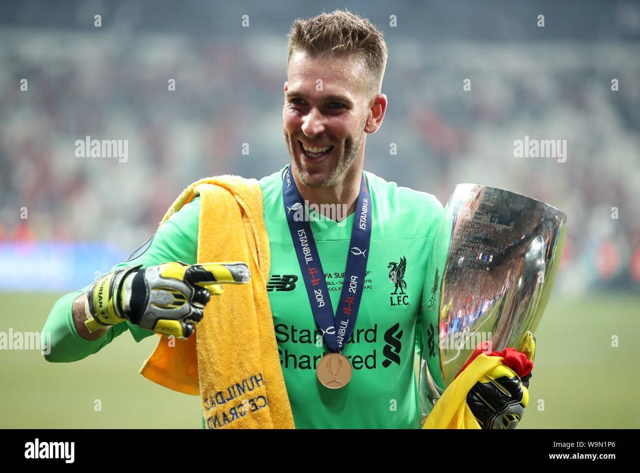 Liverpool goalkeeper Adrian lifts the trophy during the UEFA Super Cup ...