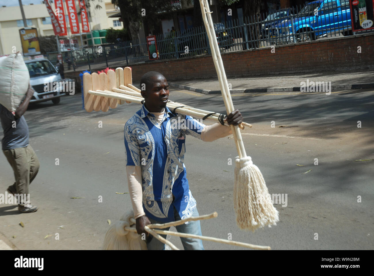 Man with broom africa hi-res stock photography and images - Alamy