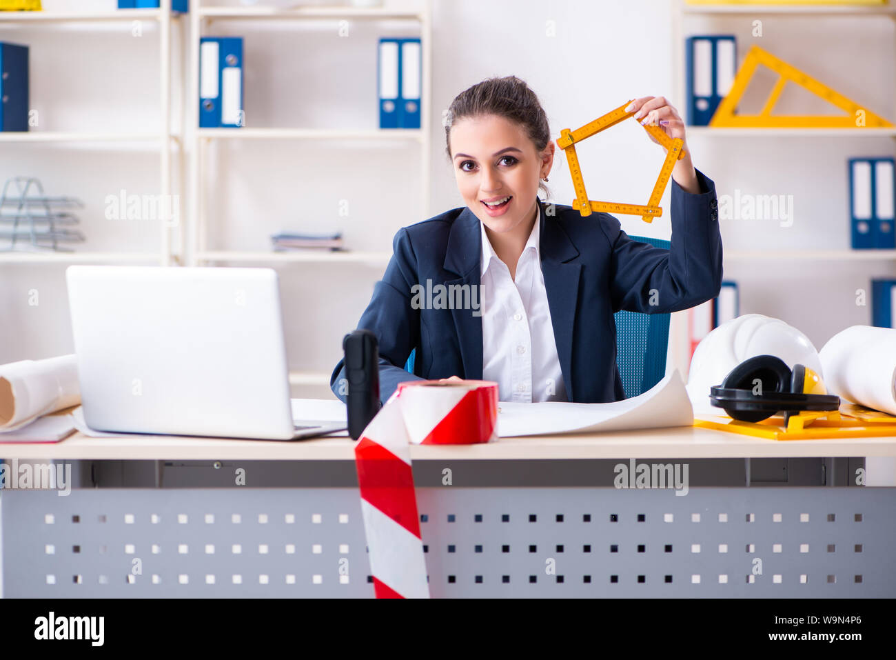 The young female architect working in the office Stock Photo - Alamy