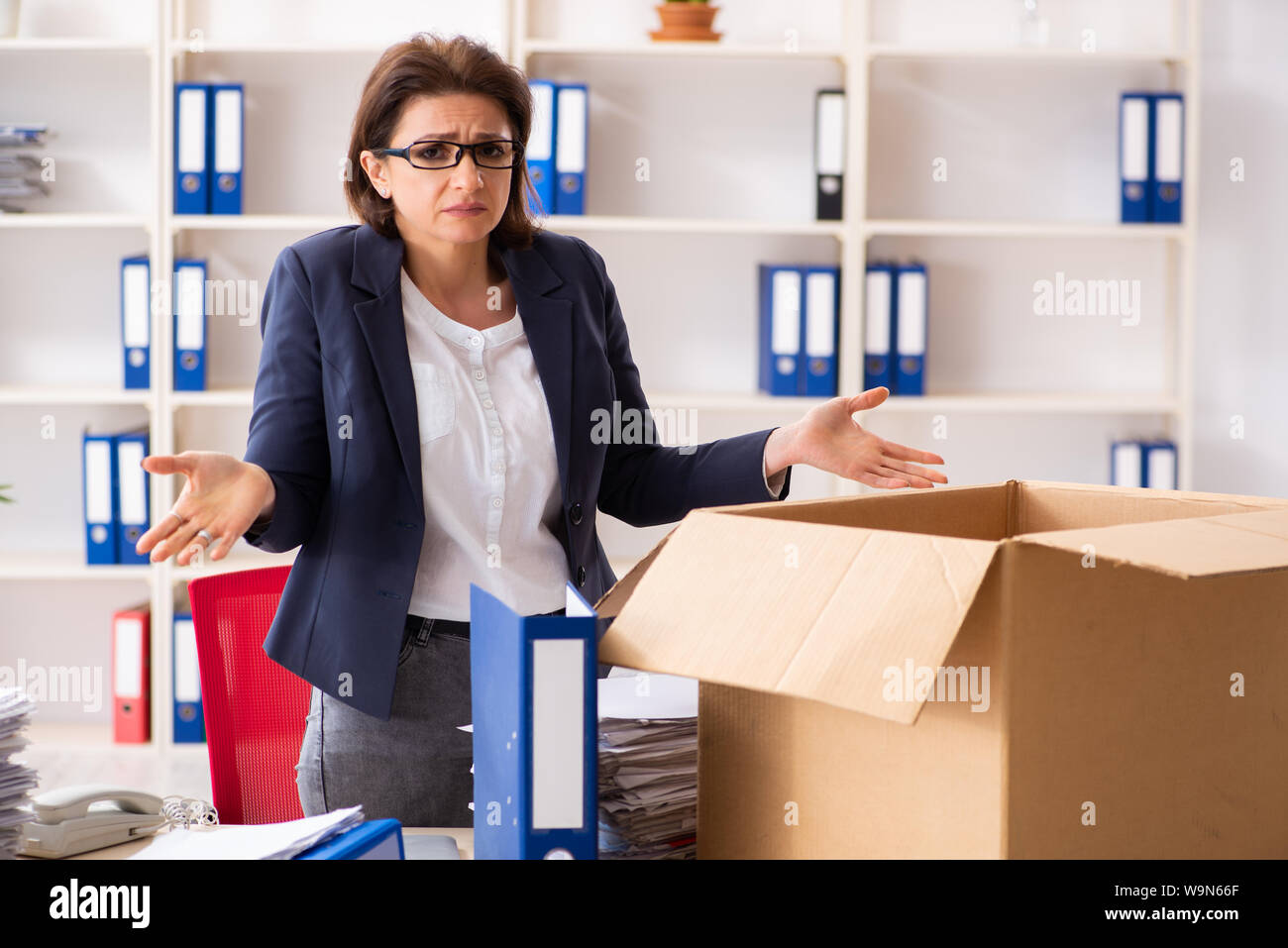 The middle-aged female employee being fired from her work Stock Photo ...