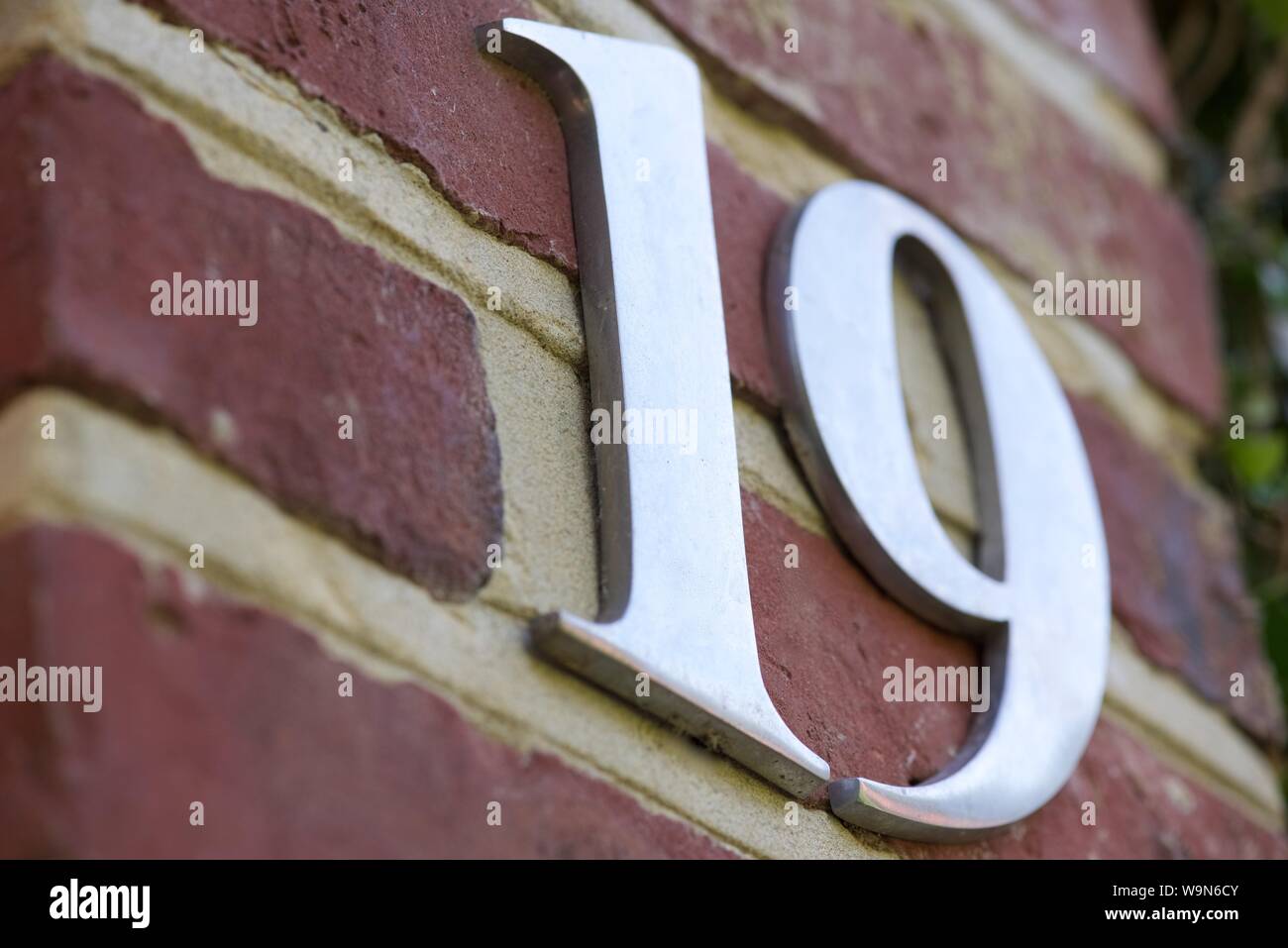 Number 19: wall-mounted, nickel plated numerals showing the house ...
