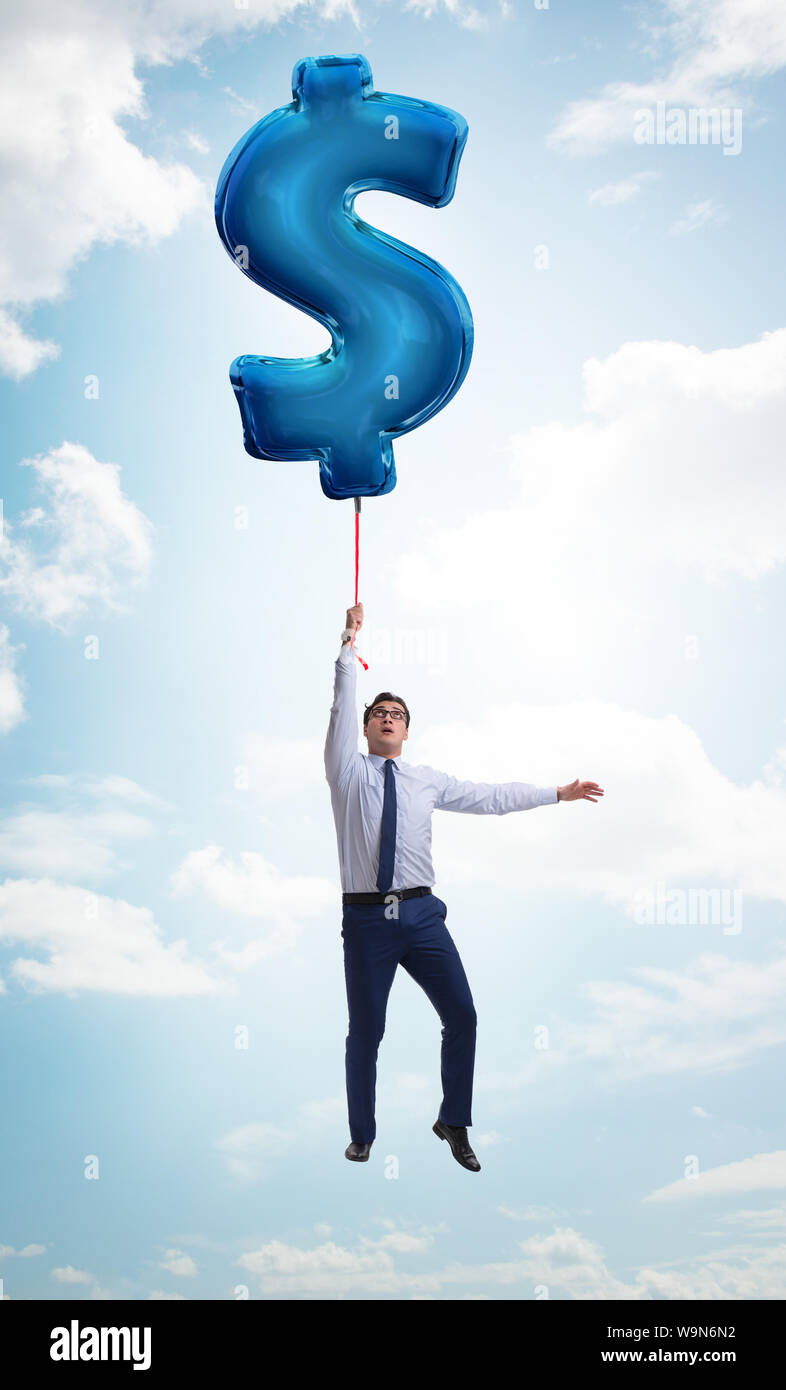The businessman flying on dollar sign inflatable balloon Stock Photo ...