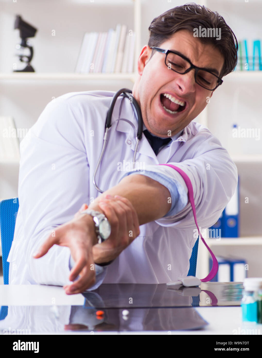 The doctor drug addict in the hospital Stock Photo - Alamy