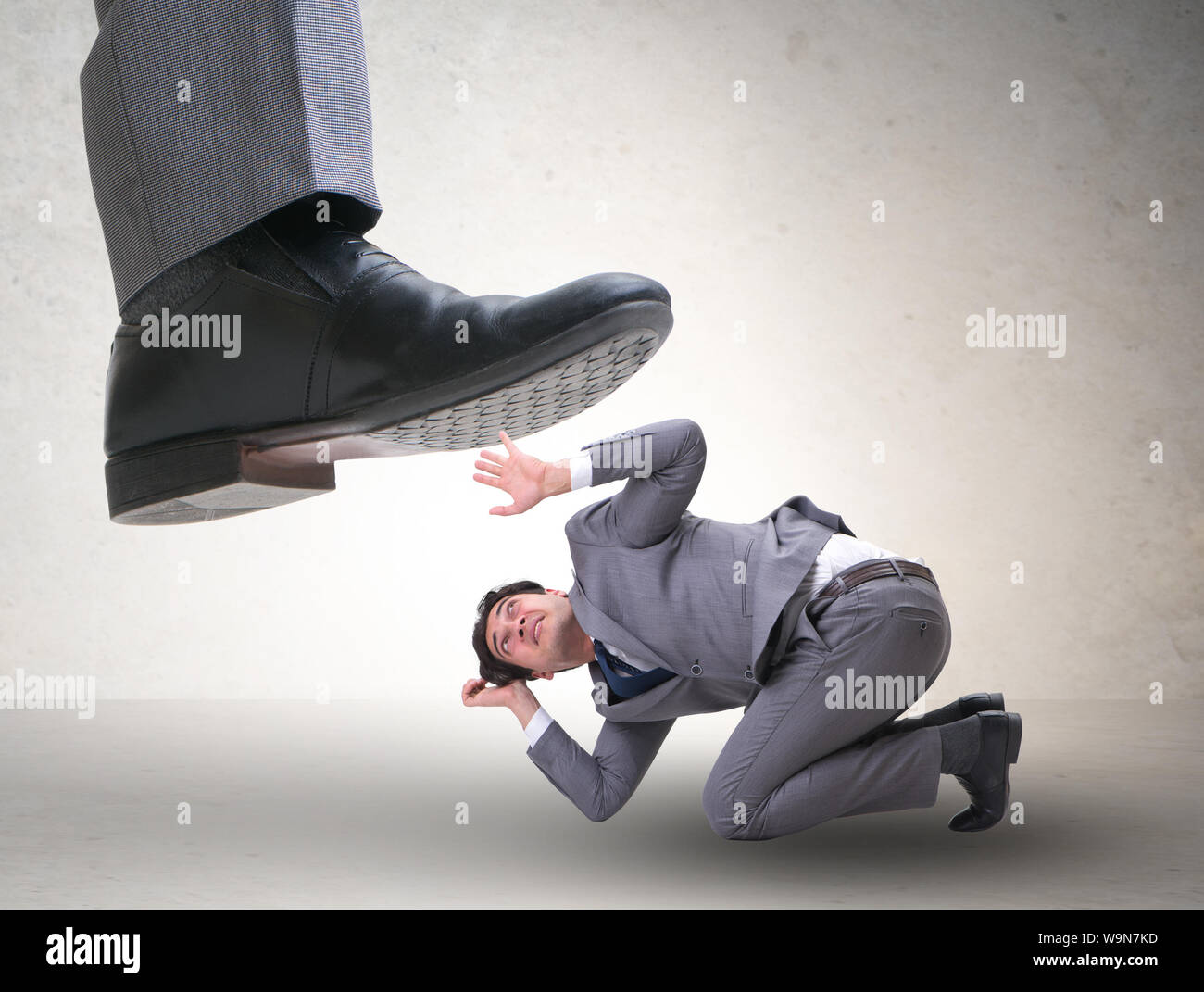 The bad angry boss stamping on employee in business concept Stock Photo ...