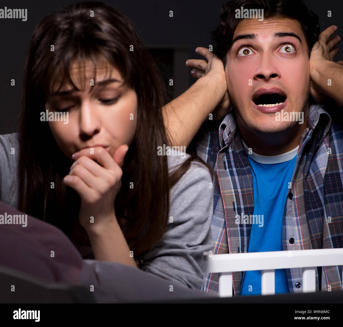 The young parents sleepless with newborn baby at night Stock Photo - Alamy