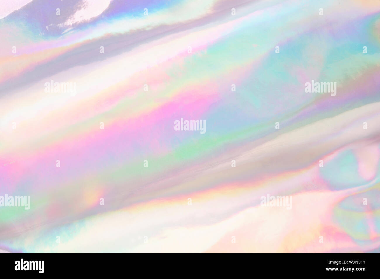 Holographic iridescent color wrinkled fabric. Abstract texture with ...