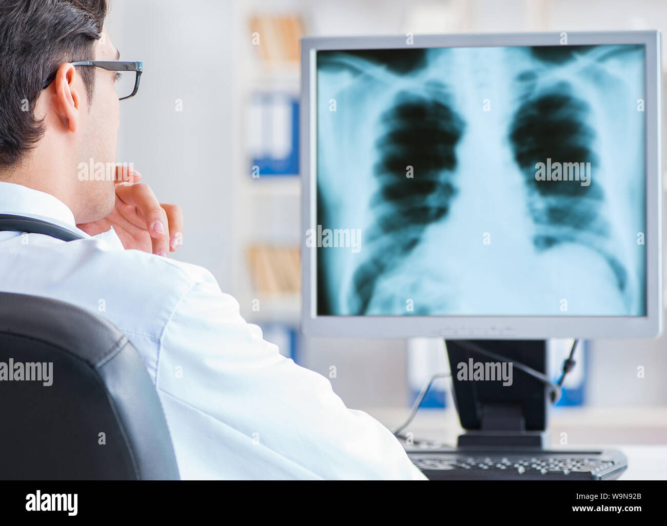 The doctor radiologist looking at x-ray images Stock Photo - Alamy