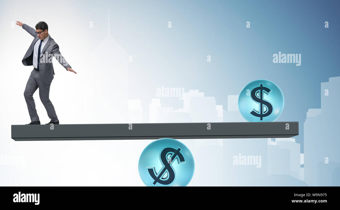 The businessman balancing in financial dollar concept Stock Photo - Alamy