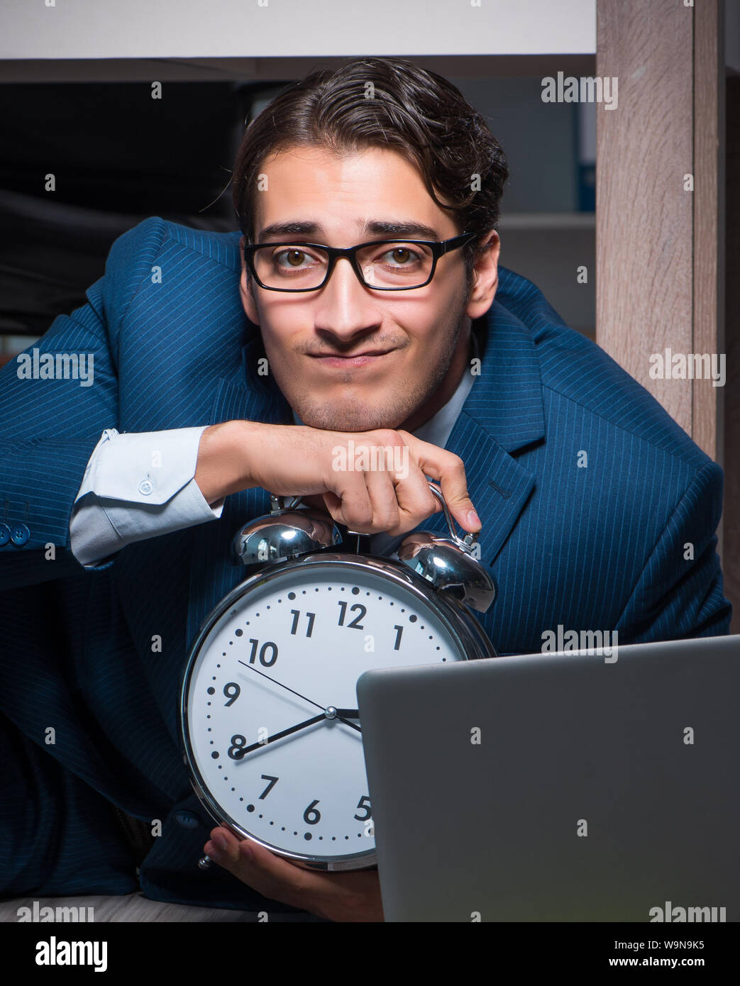 The businessman working overtime long hours late in office Stock Photo ...