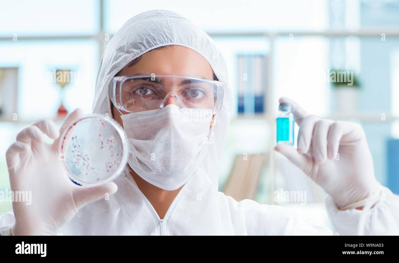 The chemist working in the laboratory with hazardous chemicals Stock ...
