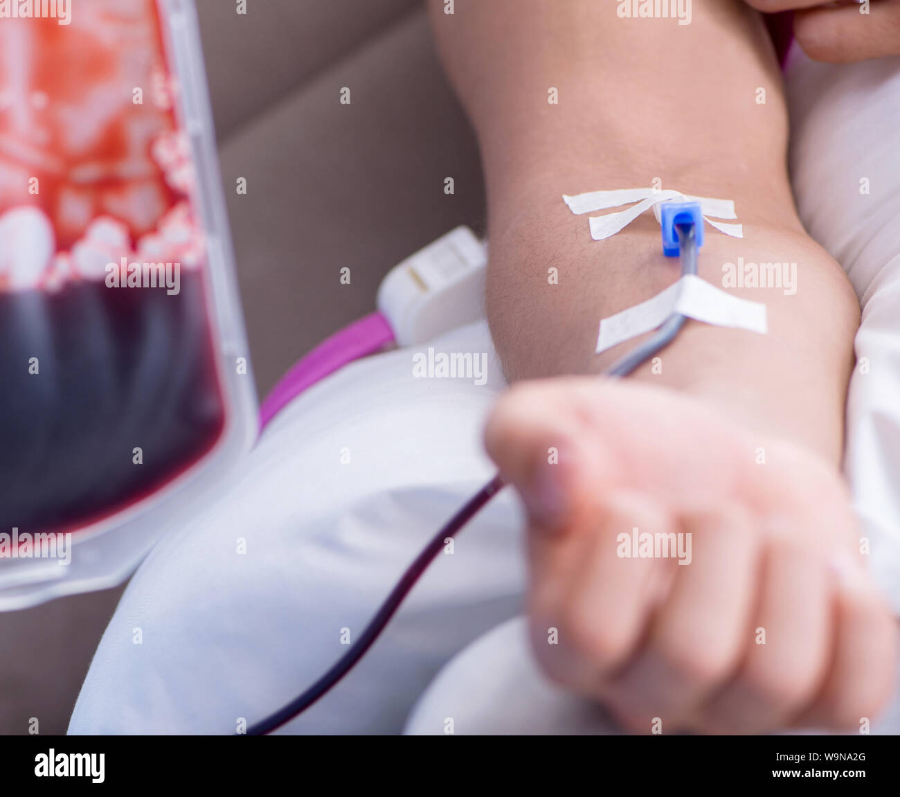 The patient getting blood transfusion in hospital clinic Stock Photo ...