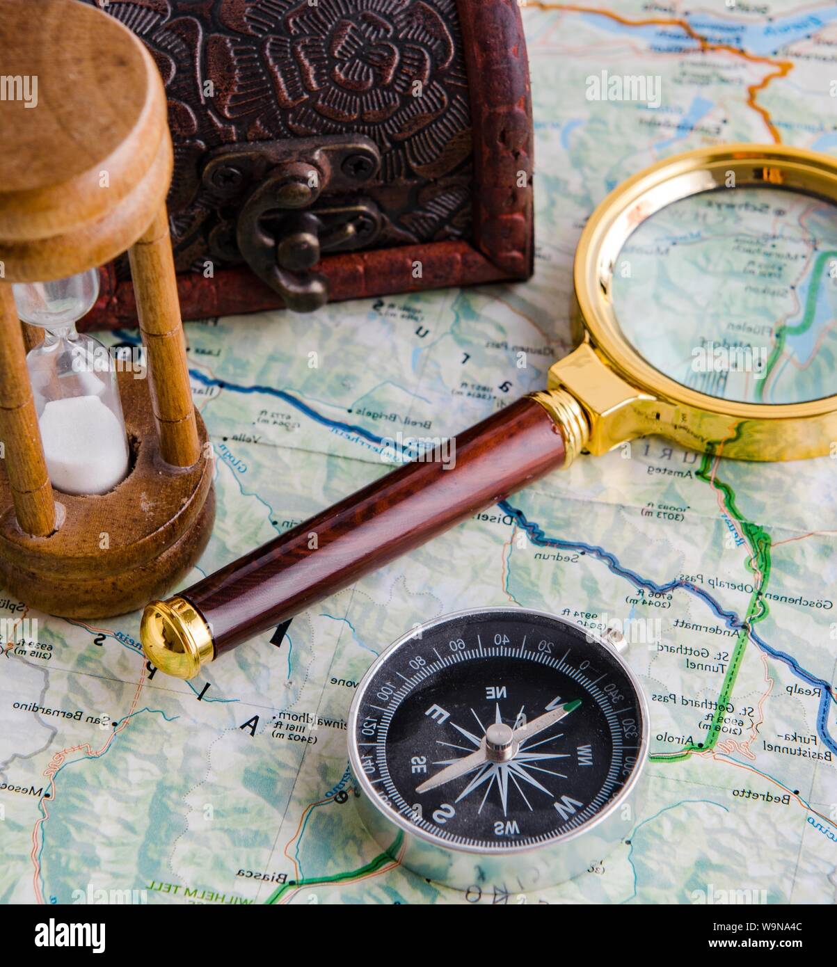 The travel concept with compass and map Stock Photo - Alamy
