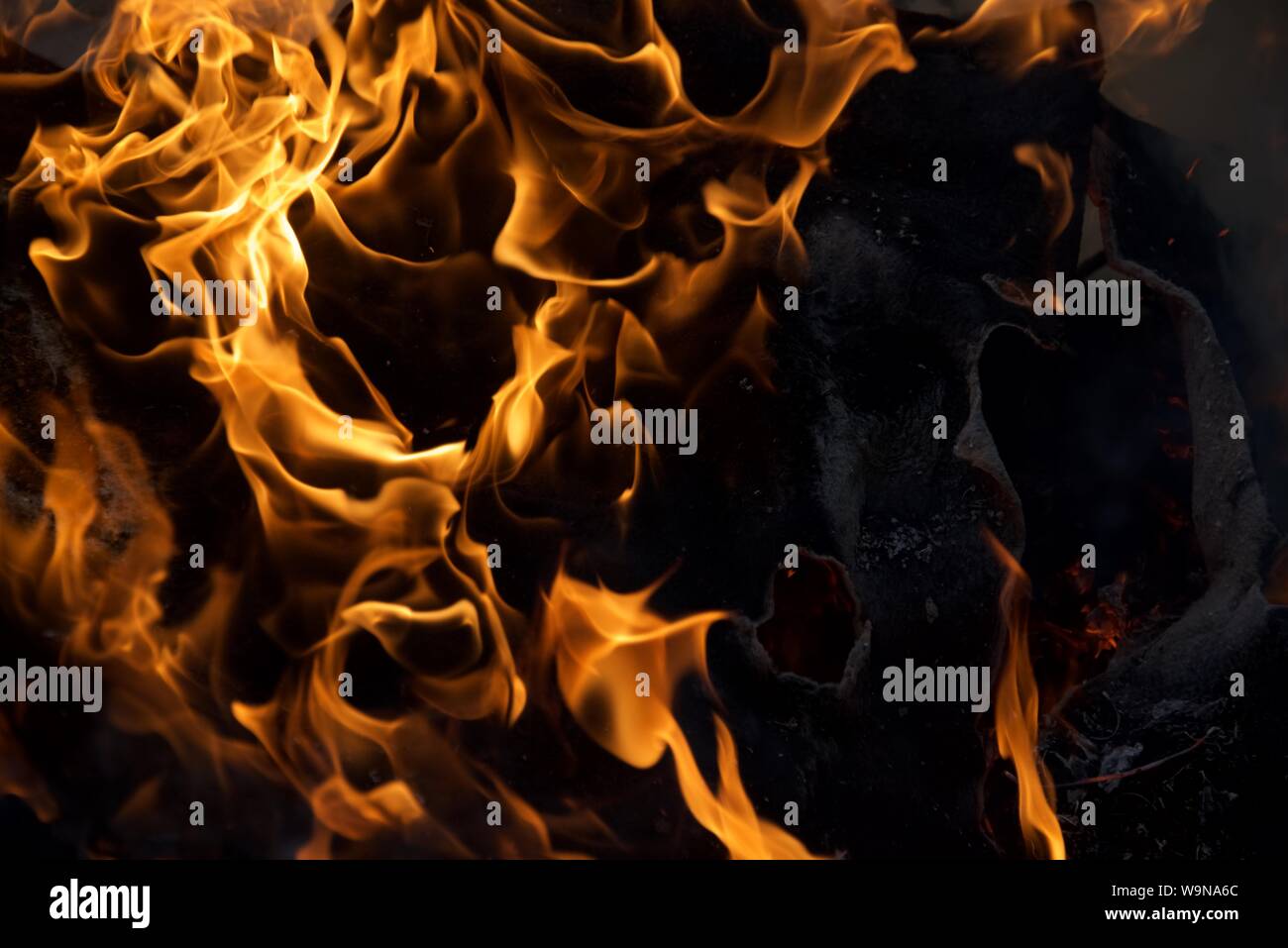 Fire: dancing flames rising from a garden bonfire Stock Photo - Alamy