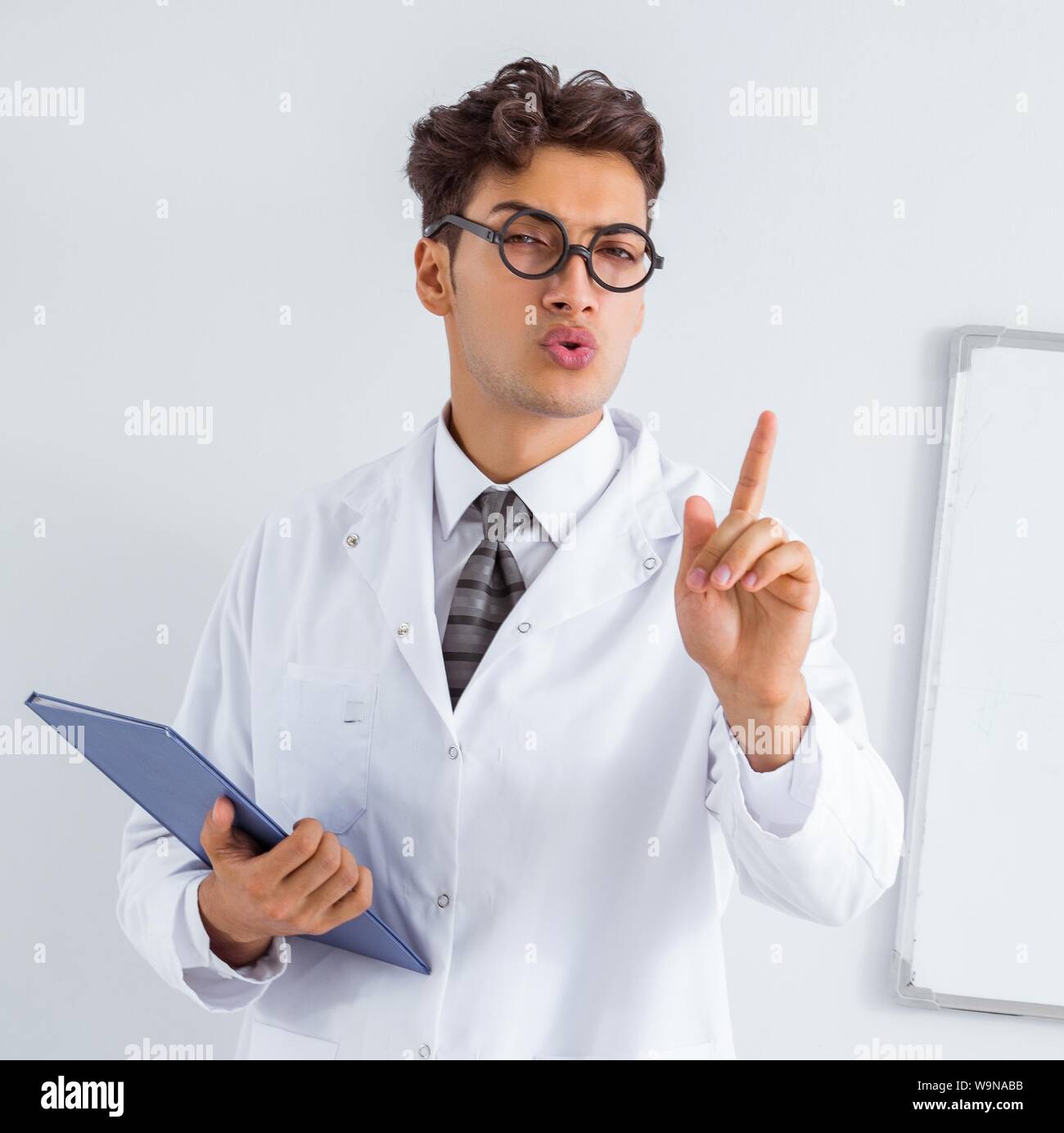 The funny doctor scientist making presentation in hospital Stock Photo ...