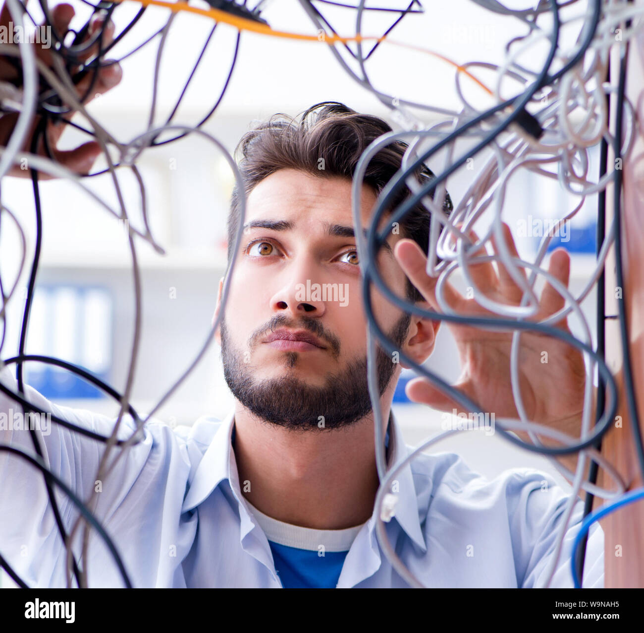 Engineer connecting network cable switch hi-res stock photography and ...