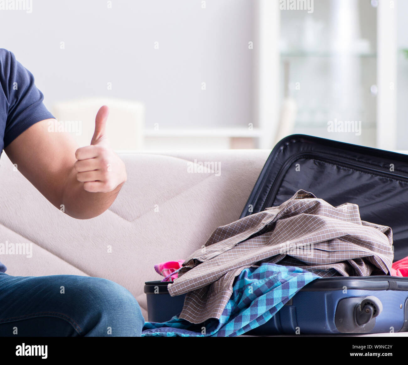 The young man preparing packing for summer vacation Stock Photo - Alamy