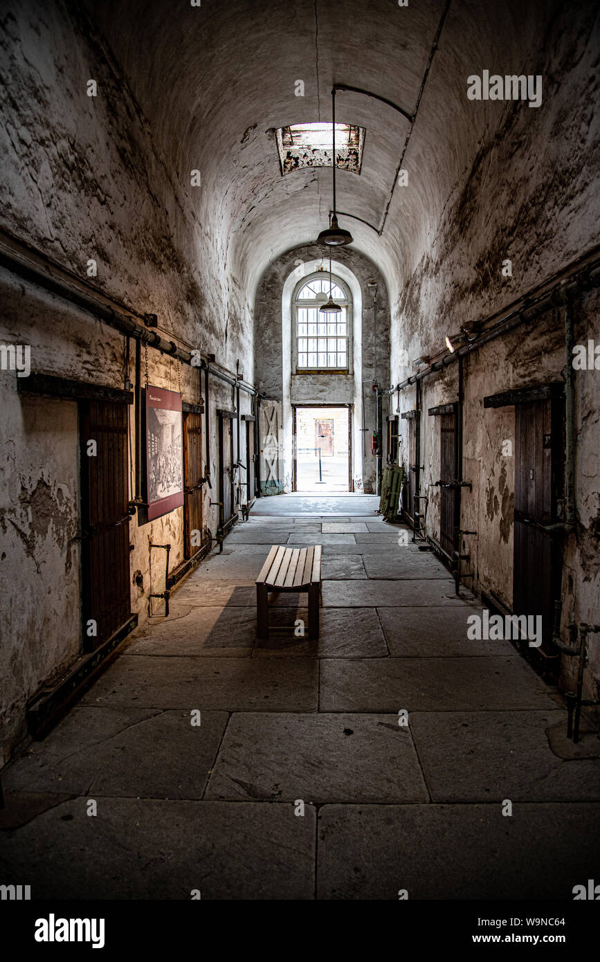 One of the wings of an abandoned penitentiary with the entrance to ...