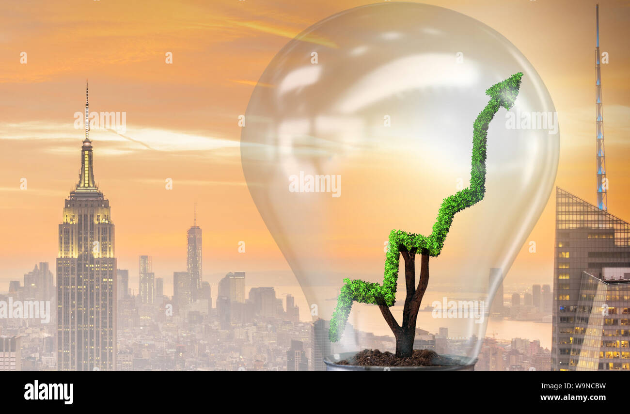 The green energy concept with green line graph in light bulb Stock ...