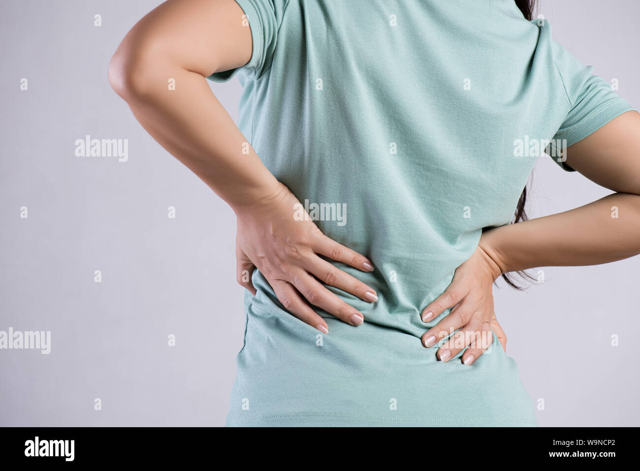 Close up woman having pain in injured back. Healthcare and back pain ...
