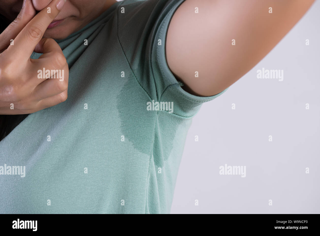 Close-up asian woman with hyperhidrosis sweating. Young asia woman with ...