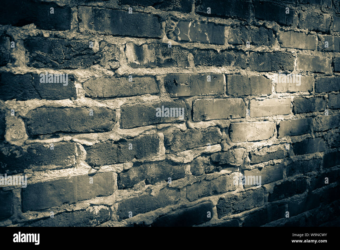 a close up and angled view of light and shadow falling across an old ...