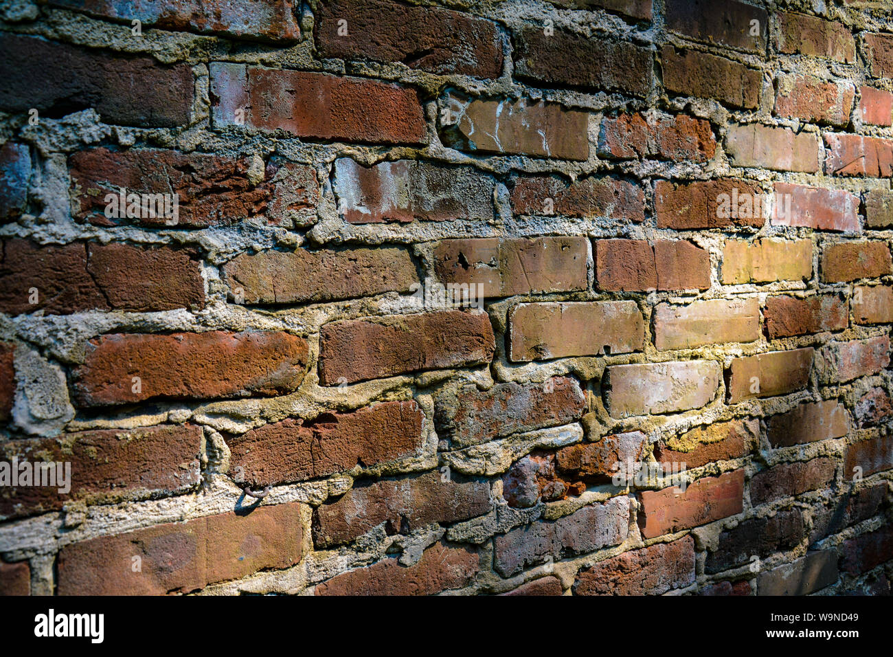 a close up and angled view of light and shadow falling across an old ...