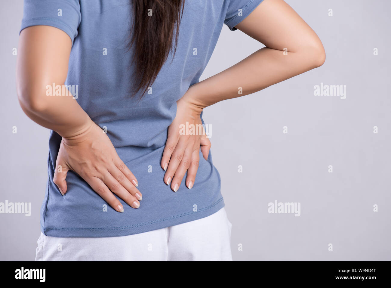 Close up woman having pain in injured back. Healthcare and back pain ...
