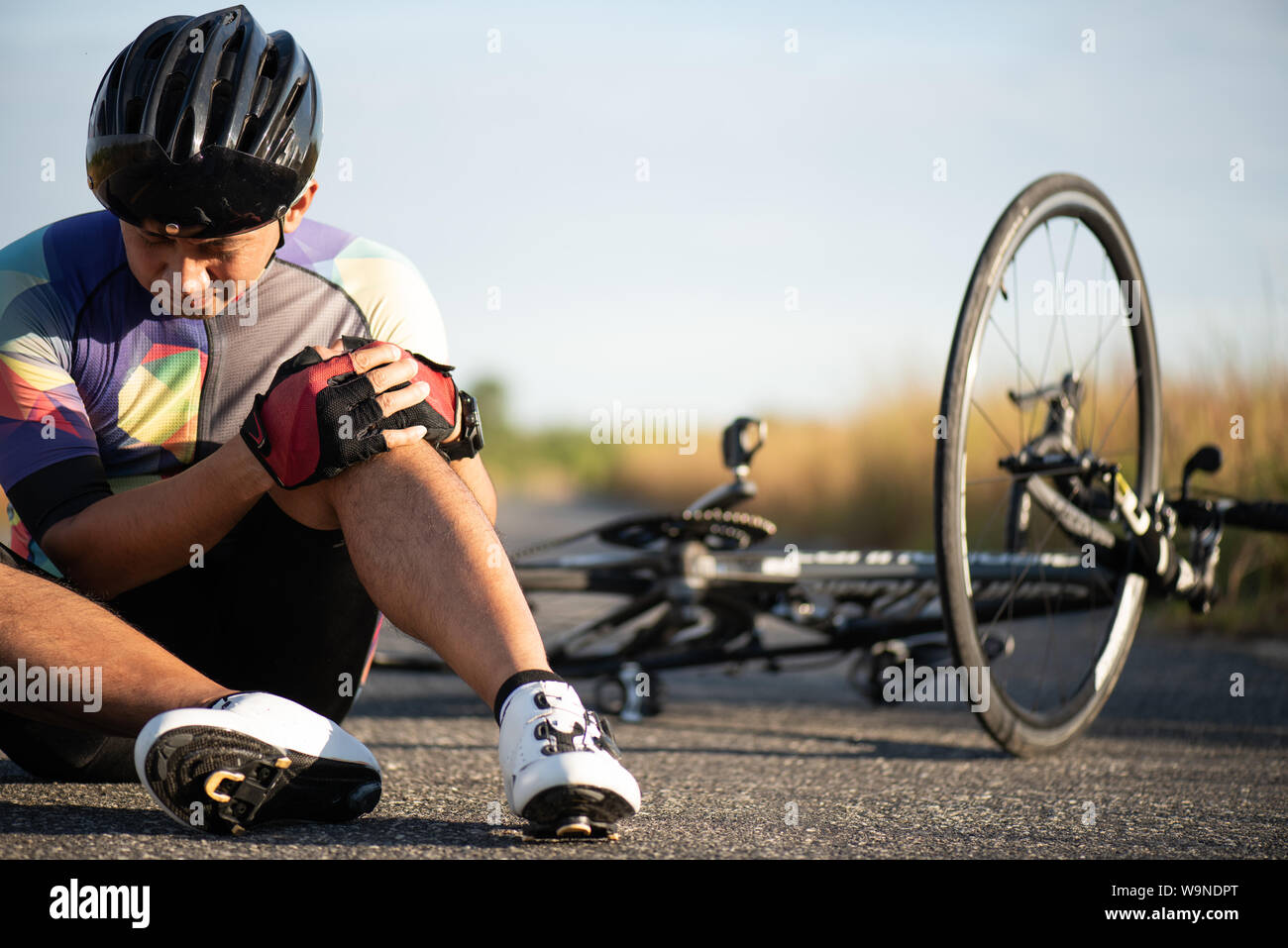 Bike injuries. Man cyclist fell fell off road bike while cycling ...