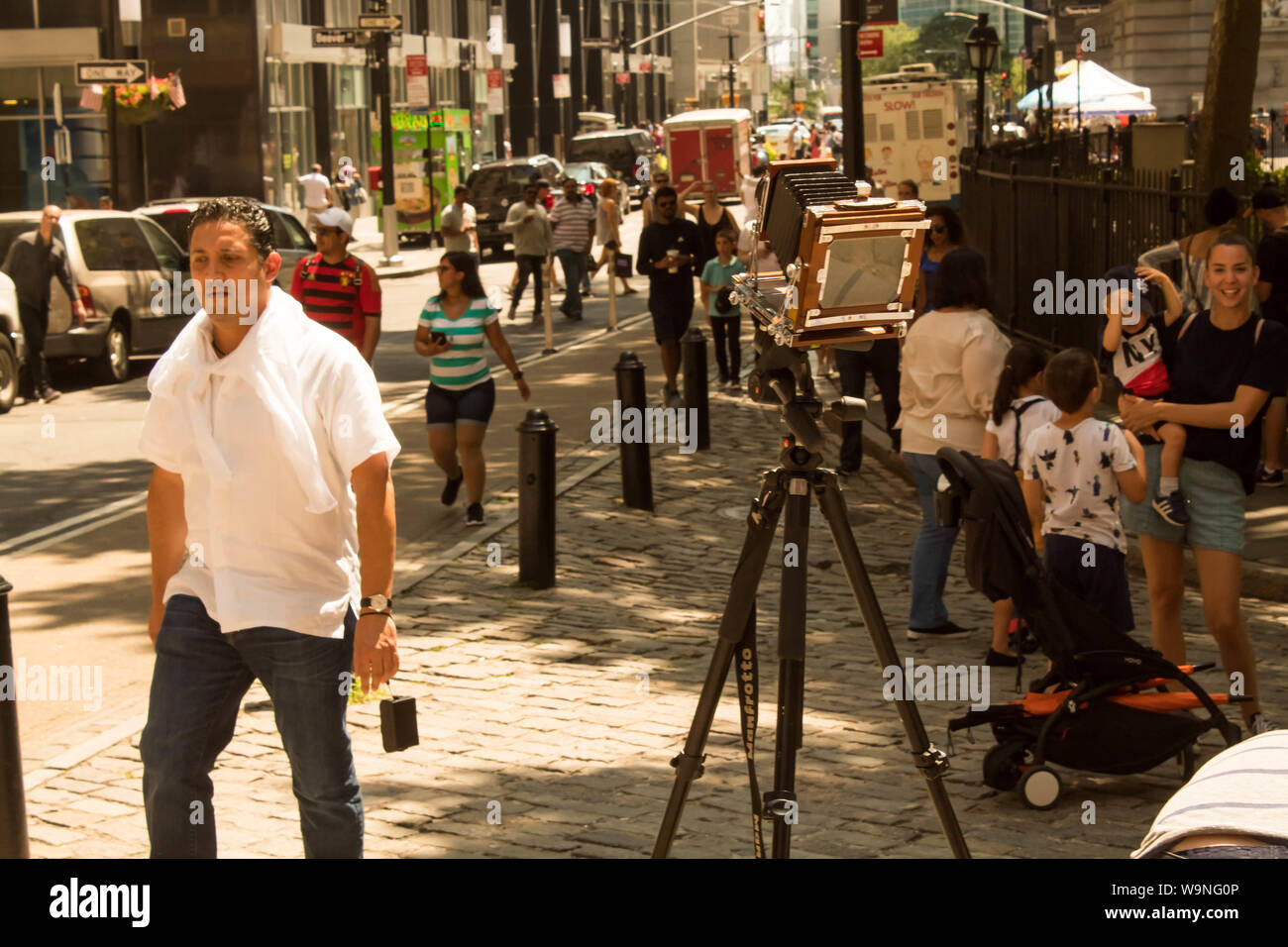 Vintage folding camera setted on tri-pod on the sidewalk of Broadway ...