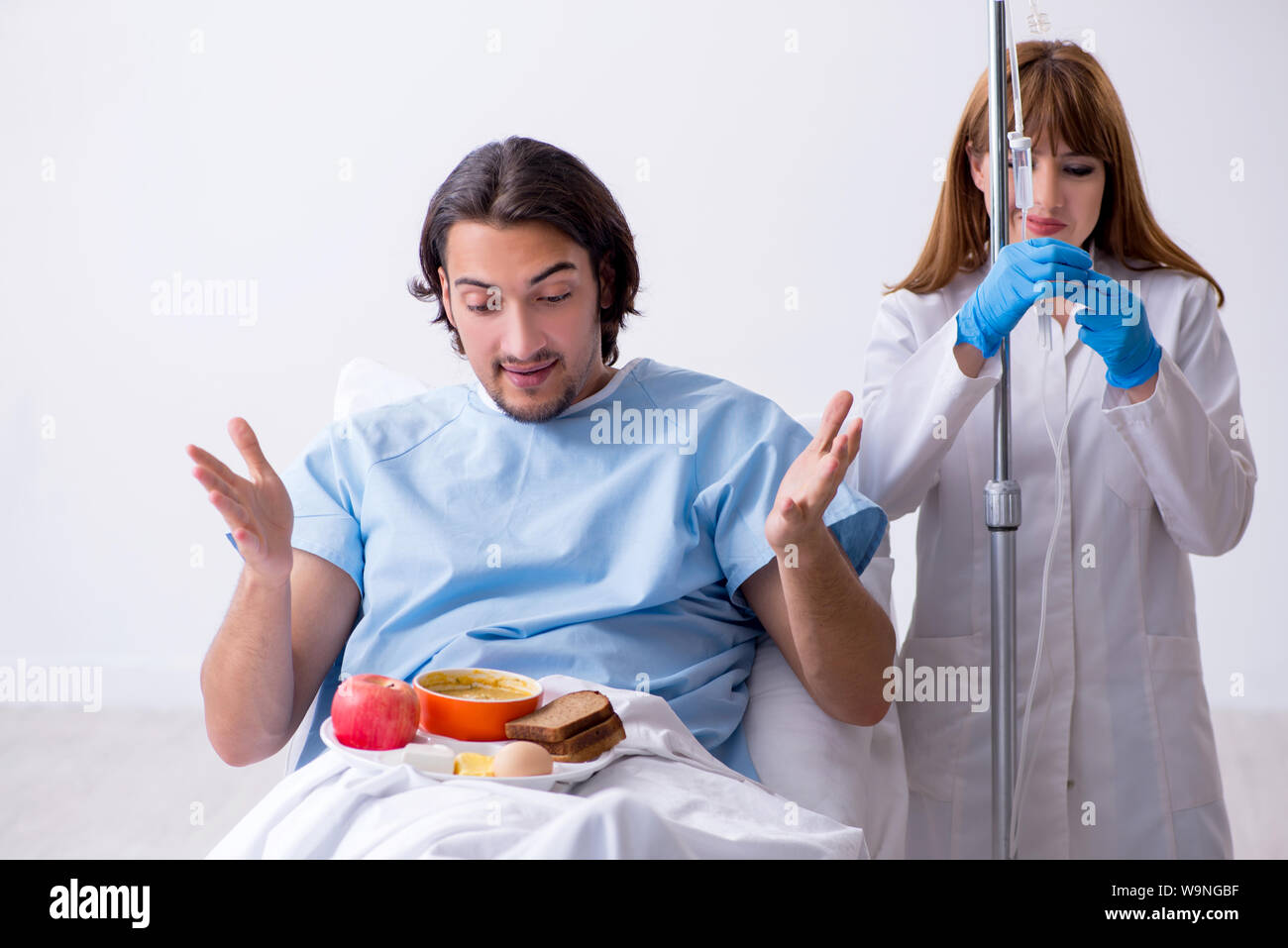 The male patient eating food in the hospital Stock Photo - Alamy