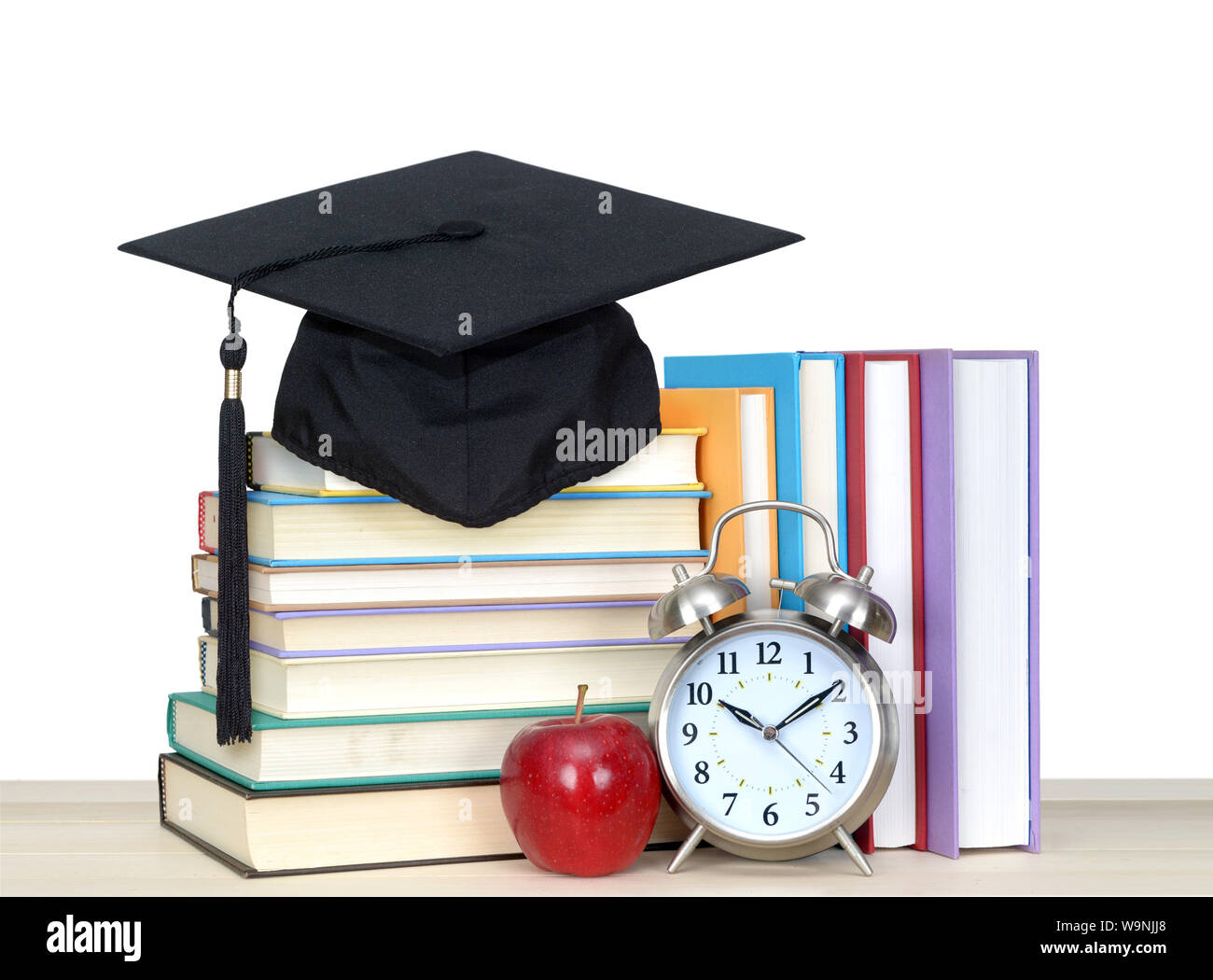book and graduation cap with clock over on white Stock Photo - Alamy