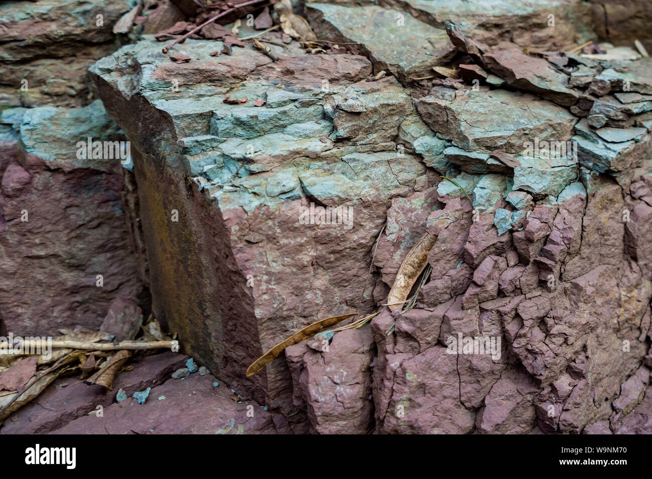 Red and blue cracked rock closeup wild nature Stock Photo - Alamy