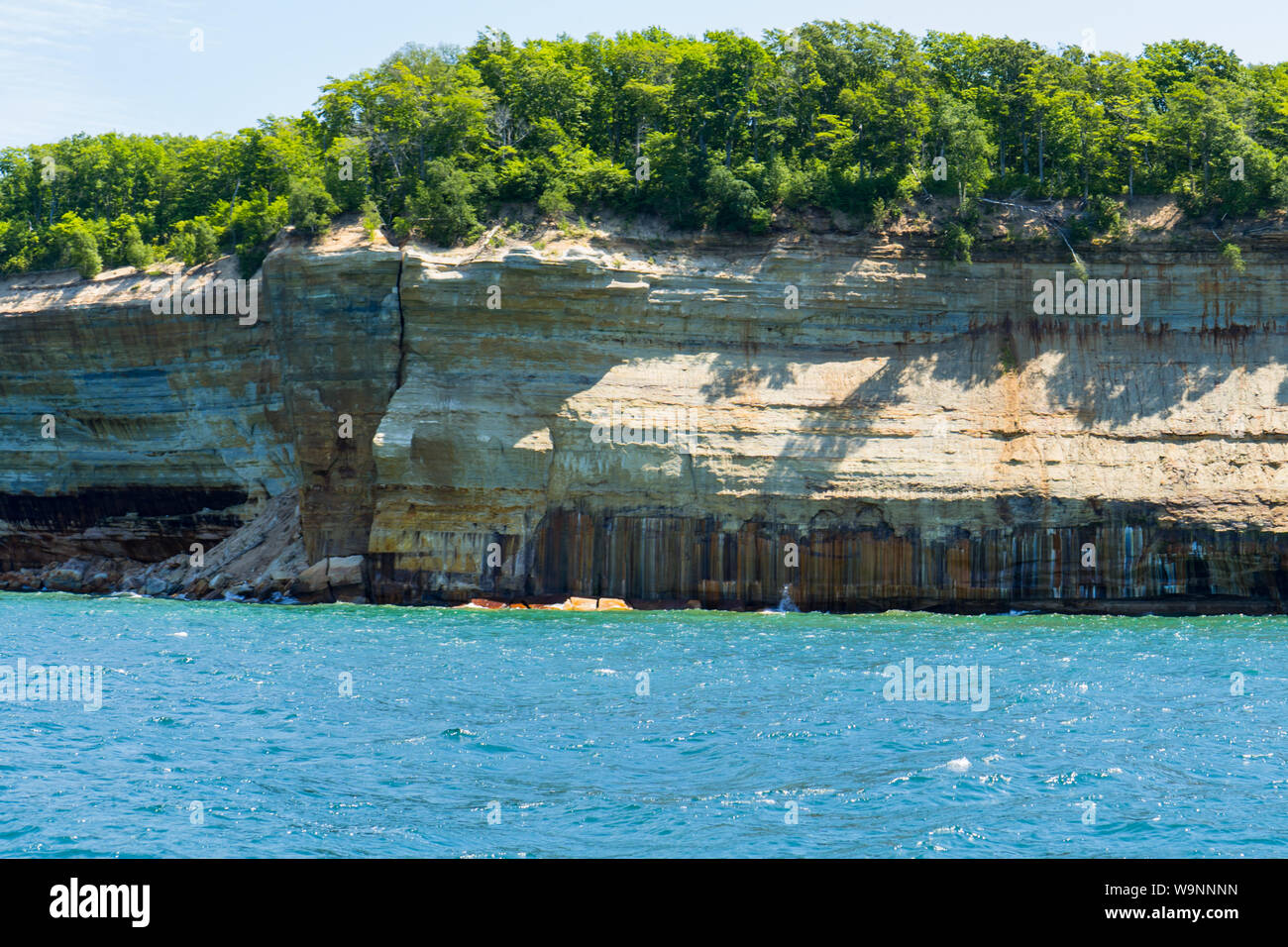 view from the lake at beautiful rocky cliff and forest , Pictured Rocks ...
