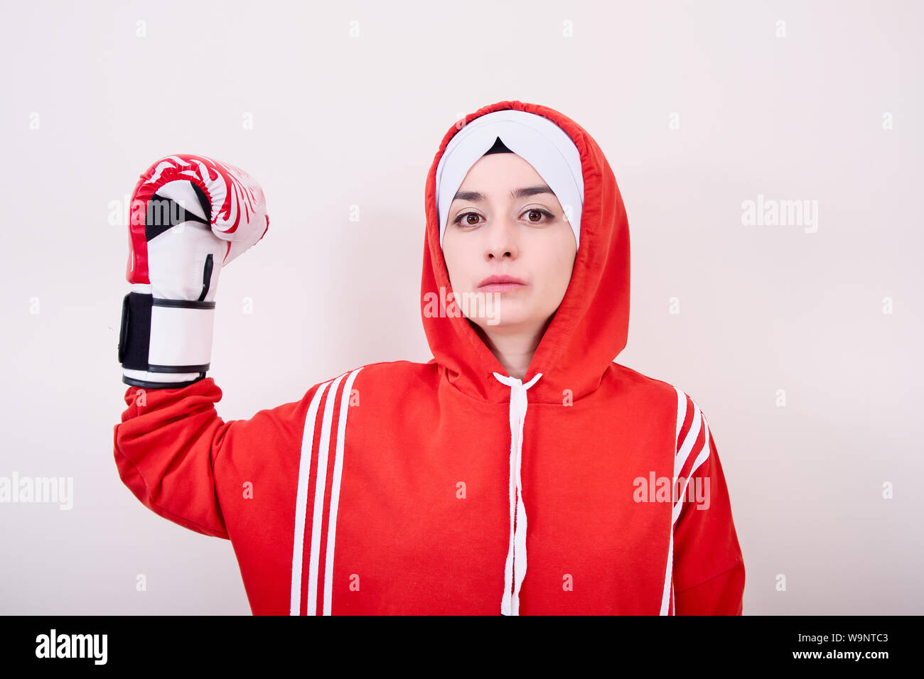 Girl boxer wearing red sport dress, woman boxer, she raised her boxing ...
