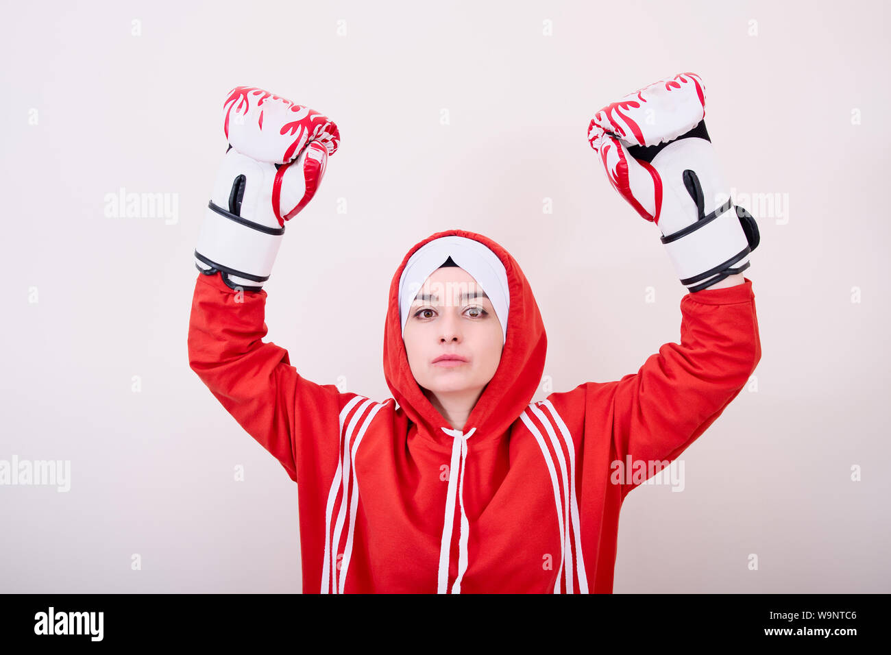 Girl boxer wearing red sport dress, woman boxer, she raised her boxing ...