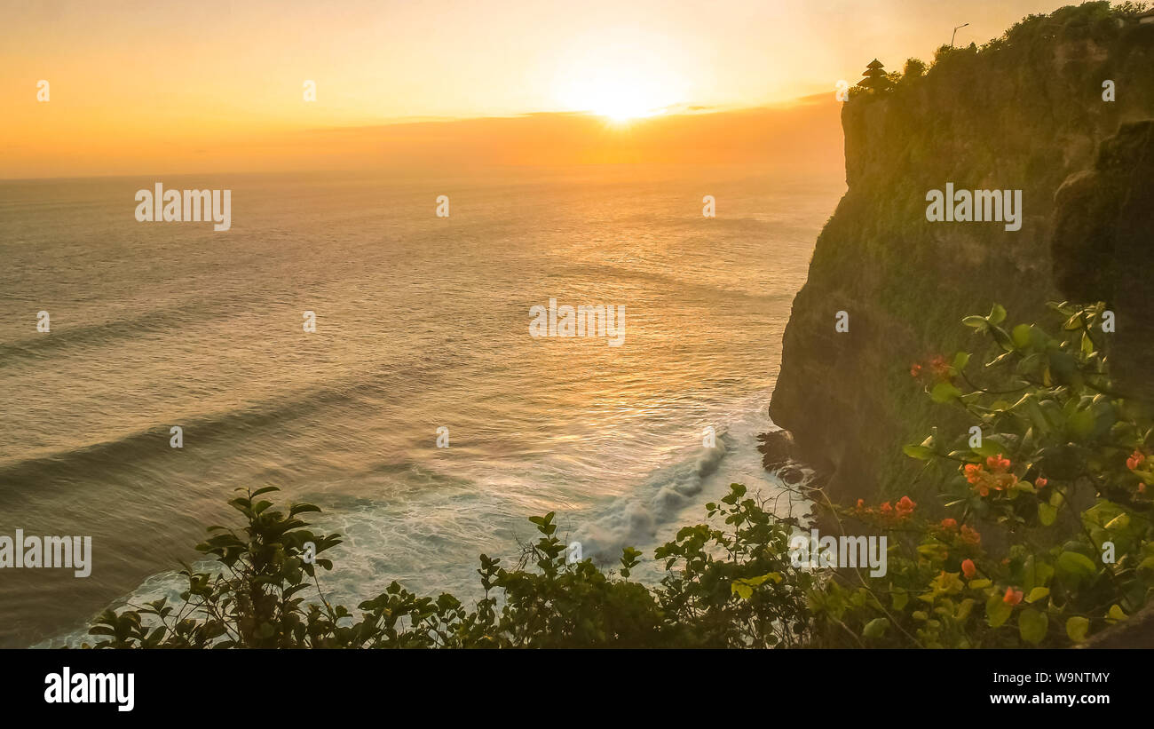 wide view of uluwatu temple and surf break at sunset on bali Stock ...
