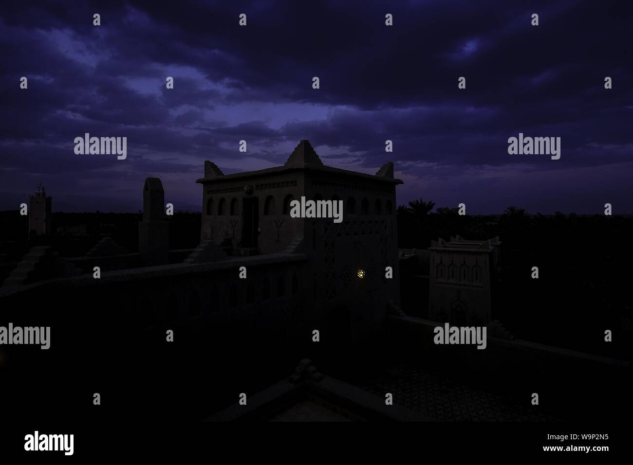 Concrete temple under a dark blue sky at nighttime Stock Photo - Alamy