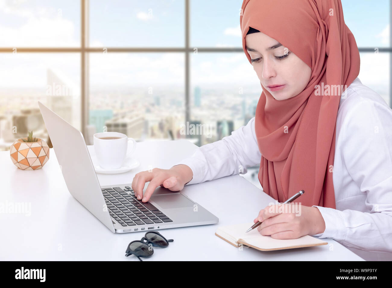 Hijab muslim woman work with computer, muslim girl sitting in office ...