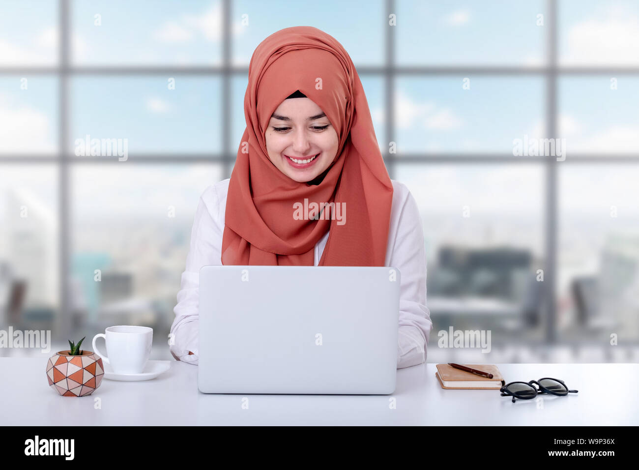 Hijab muslim woman work with computer, muslim girl sitting in office ...