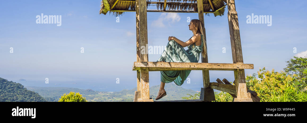 Young woman in traditional balinese gazebo. Bali island BANNER, LONG ...