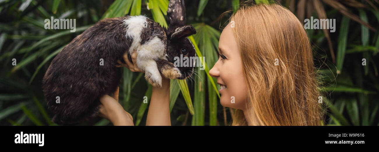 Woman holding a rabbit. Cosmetics test on rabbit animal. Cruelty free ...