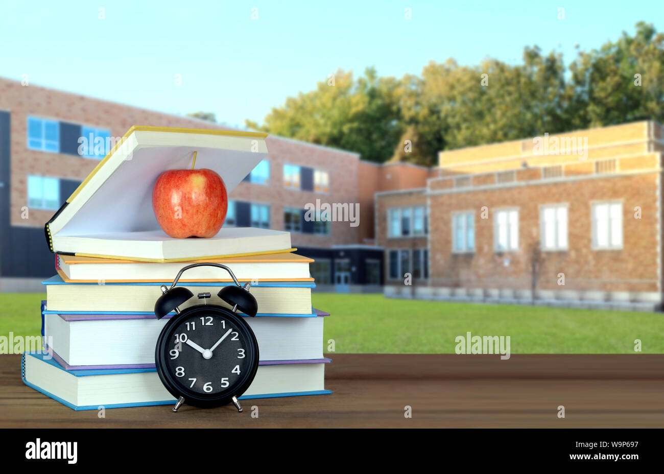 An education concept with book and blurry background of school with big ...