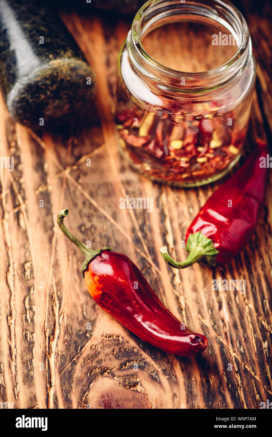 Sun dried red chili peppers on wooden surface Stock Photo - Alamy
