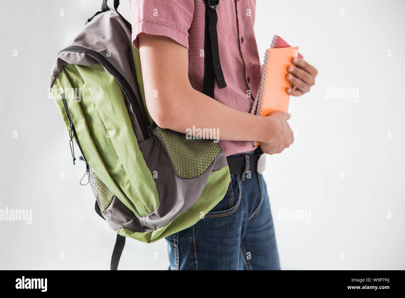 College student holding book Stock Photo - Alamy