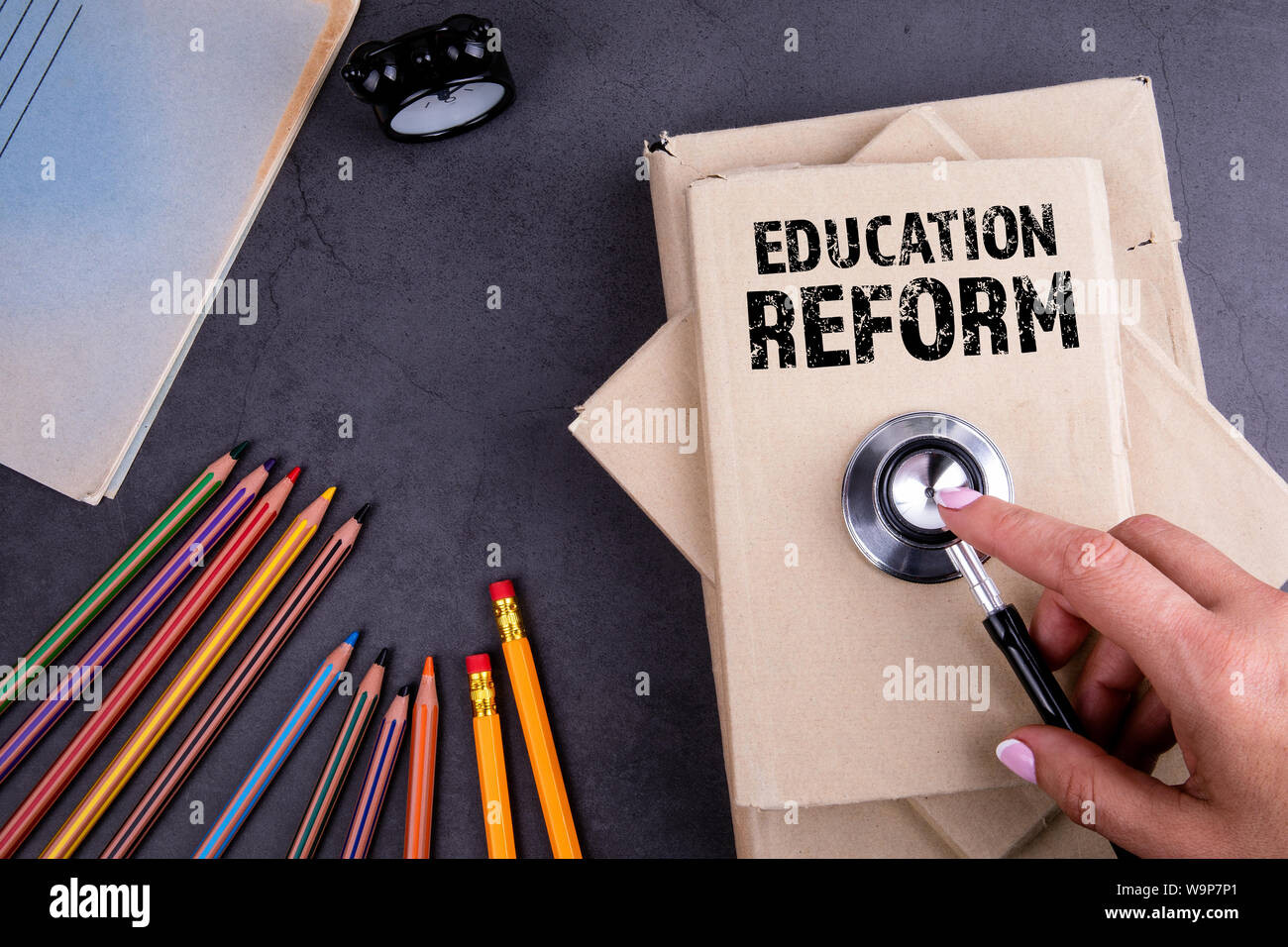 Education Reform concept. Stack of books Stock Photo - Alamy