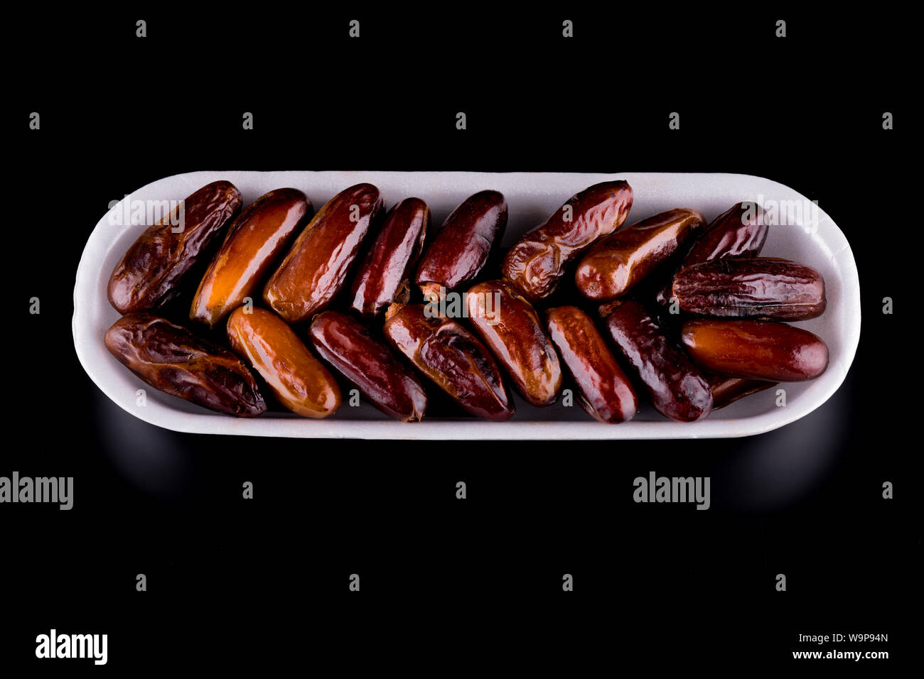 dried dates, traditional Arabic sweets on a black background Stock ...