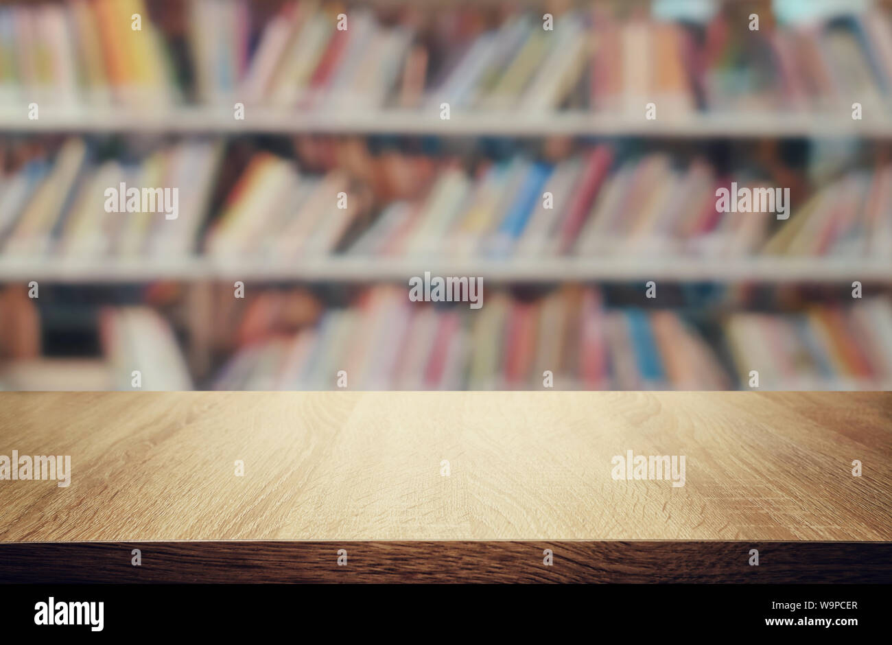 education and learning concept of empty wooden table in library. for ...
