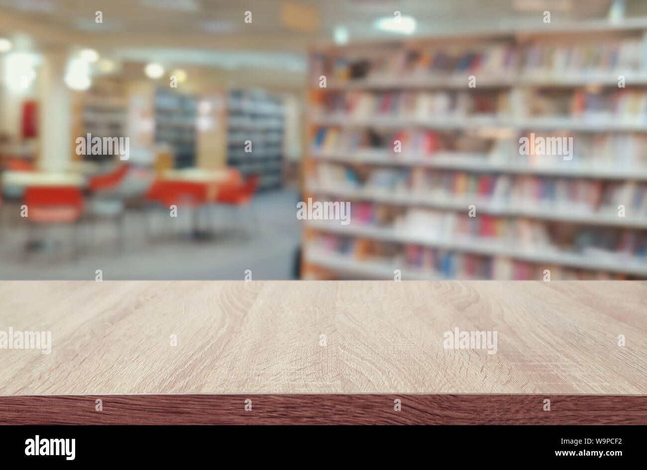 education and learning concept of empty wooden table in library. for ...