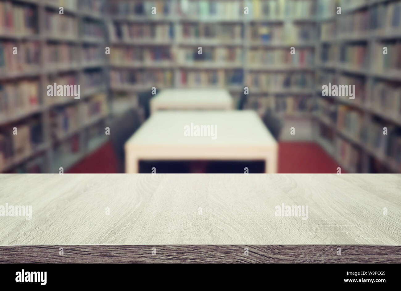 education and learning concept of empty wooden table in library. for ...