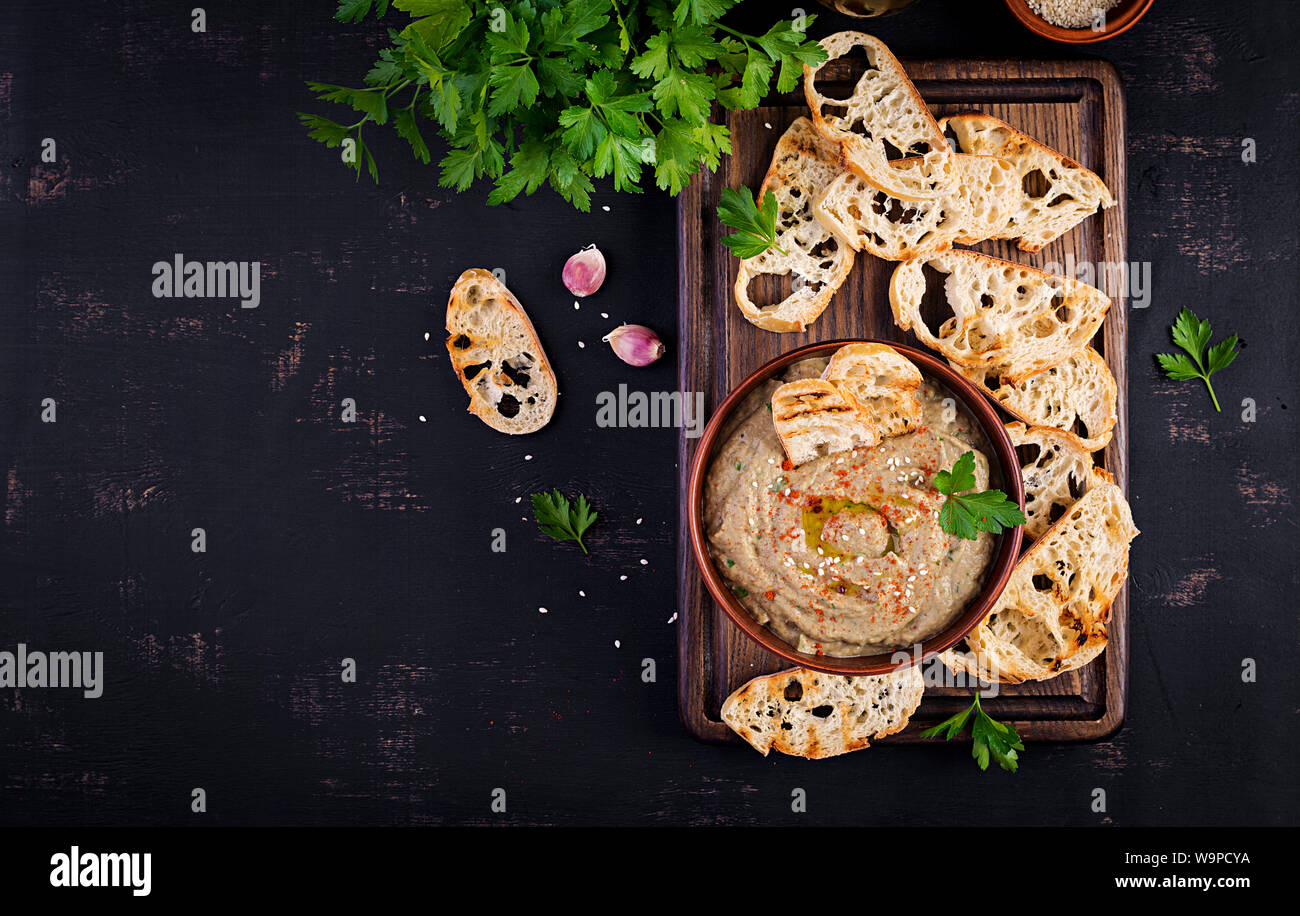 Baba ghanoush vegan hummus from eggplant with seasoning, parsley and ...